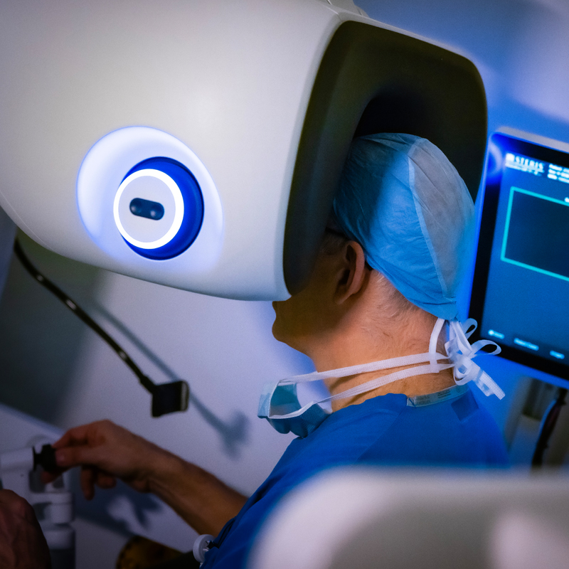 Your surgeon sits at a console next to you and controls the movement of ...